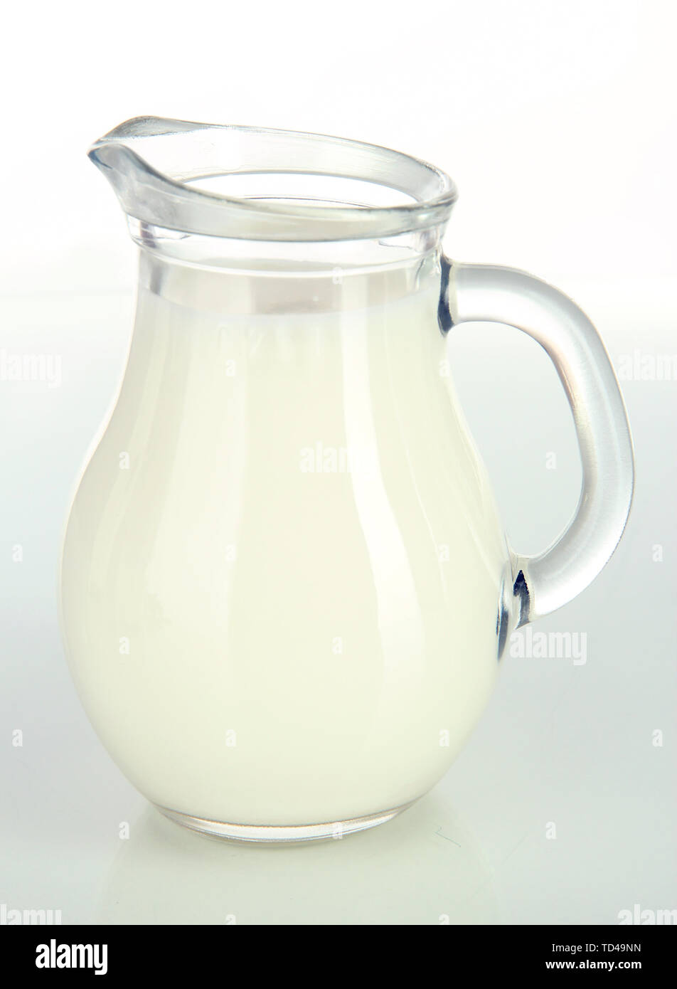Pitcher of milk isolated on white Stock Photo - Alamy