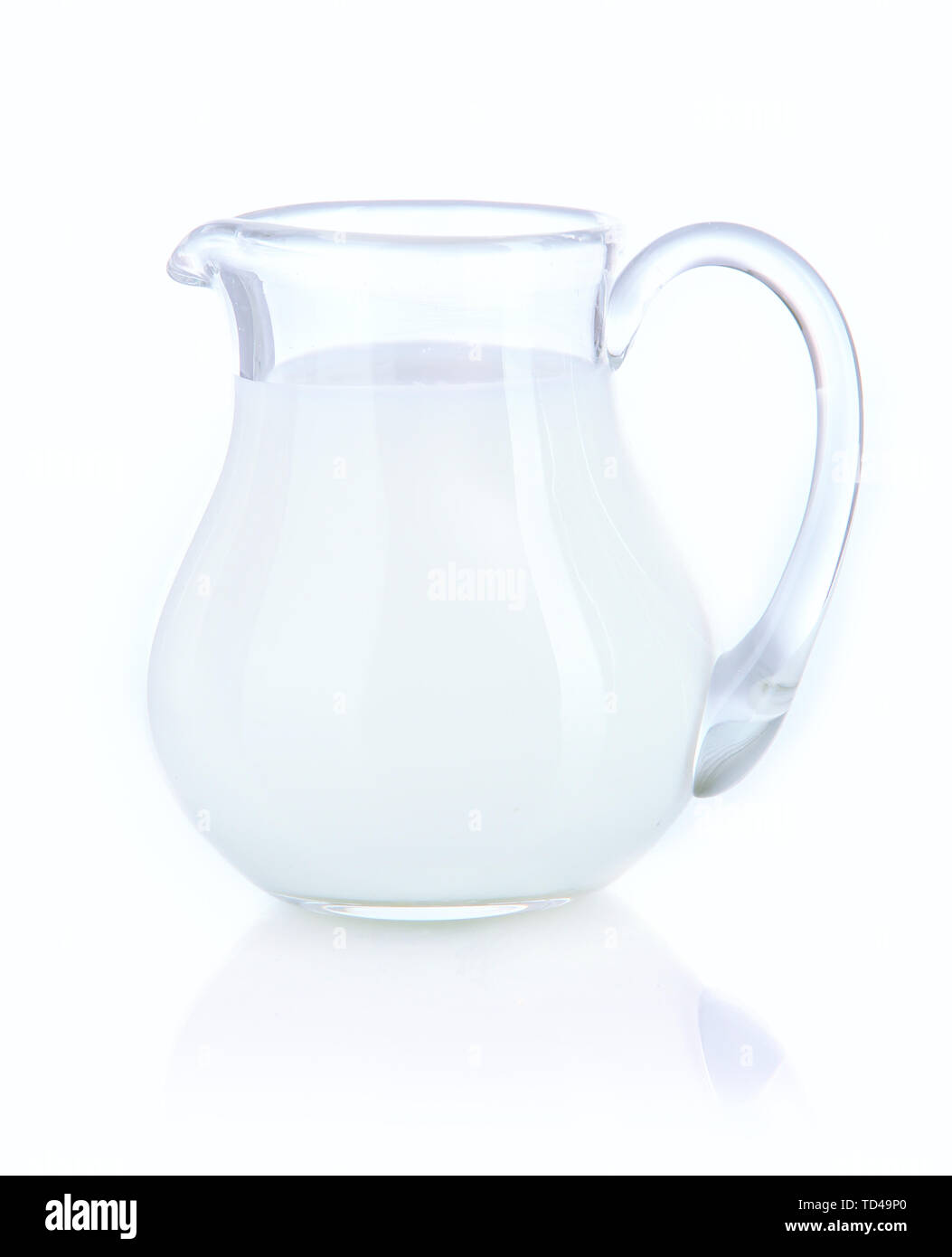 Milk pouring into pitcher Cut Out Stock Images & Pictures - Alamy
