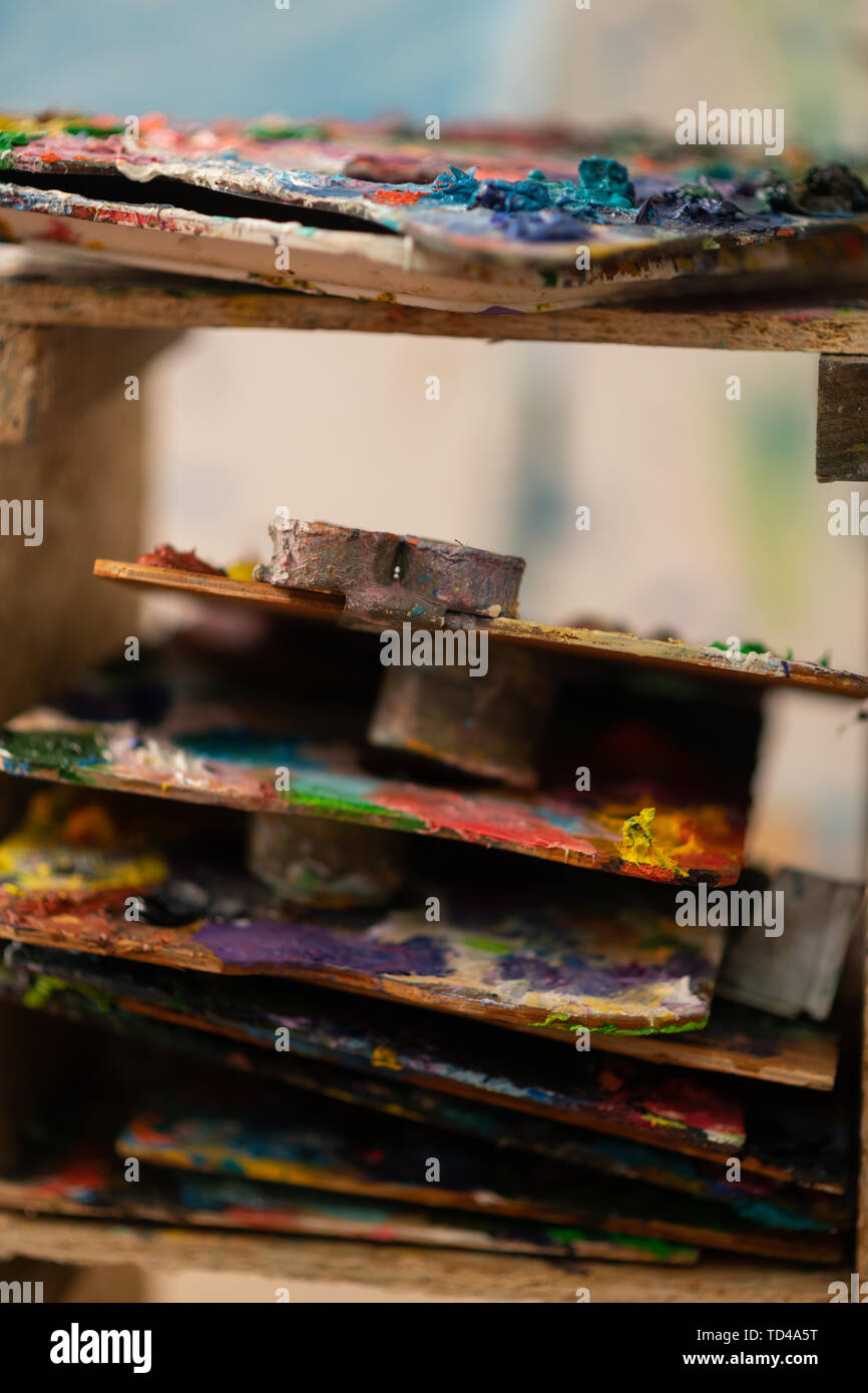 Colorful gouache. Close up of palettes with colorful gouache lying on ...