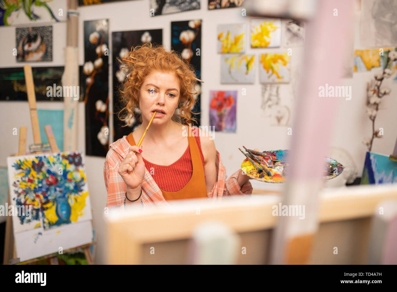 Red-haired art student. Red-haired art student feeling involved in ...