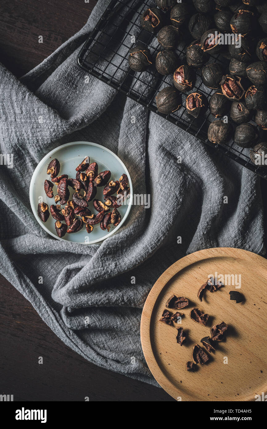 Peel pecans by hand Stock Photo - Alamy