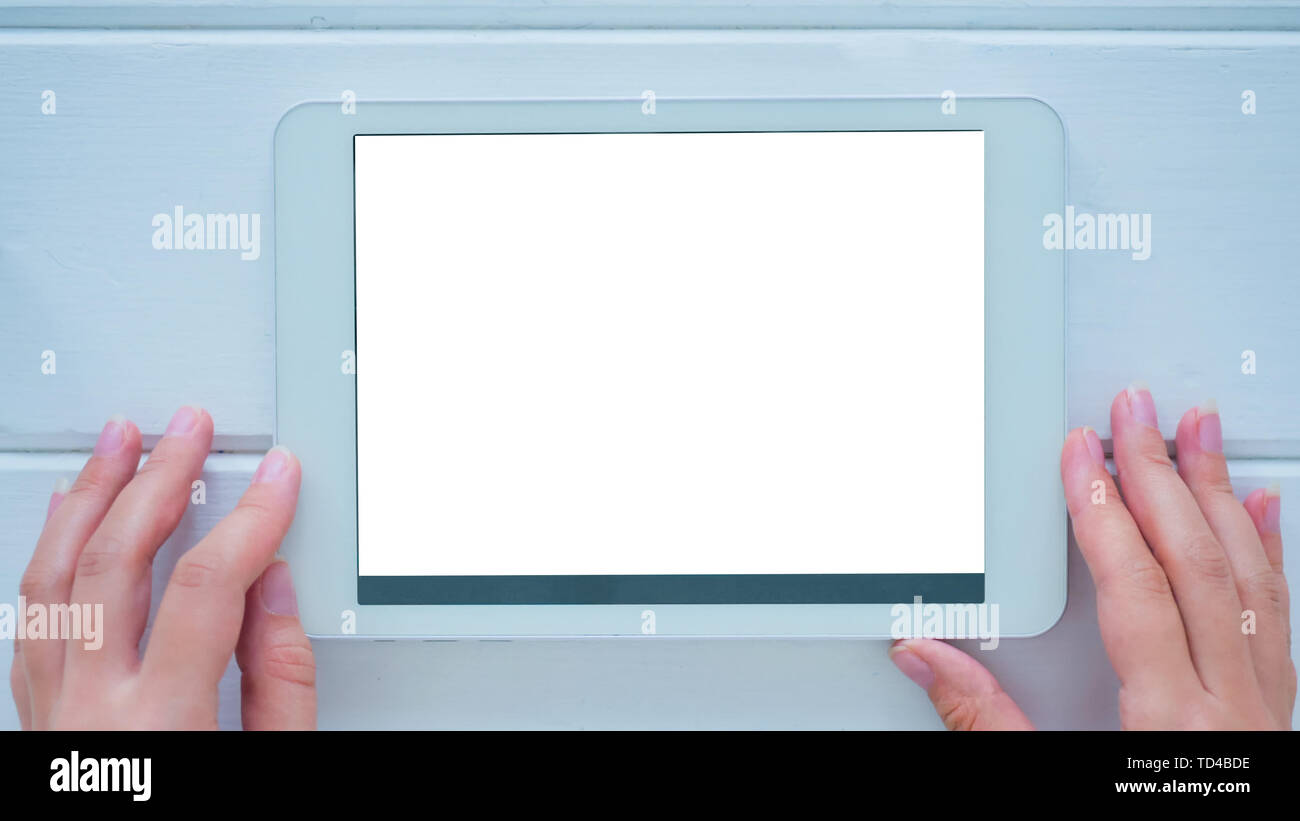 Woman looking at tablet computer with white empty display Stock Photo ...