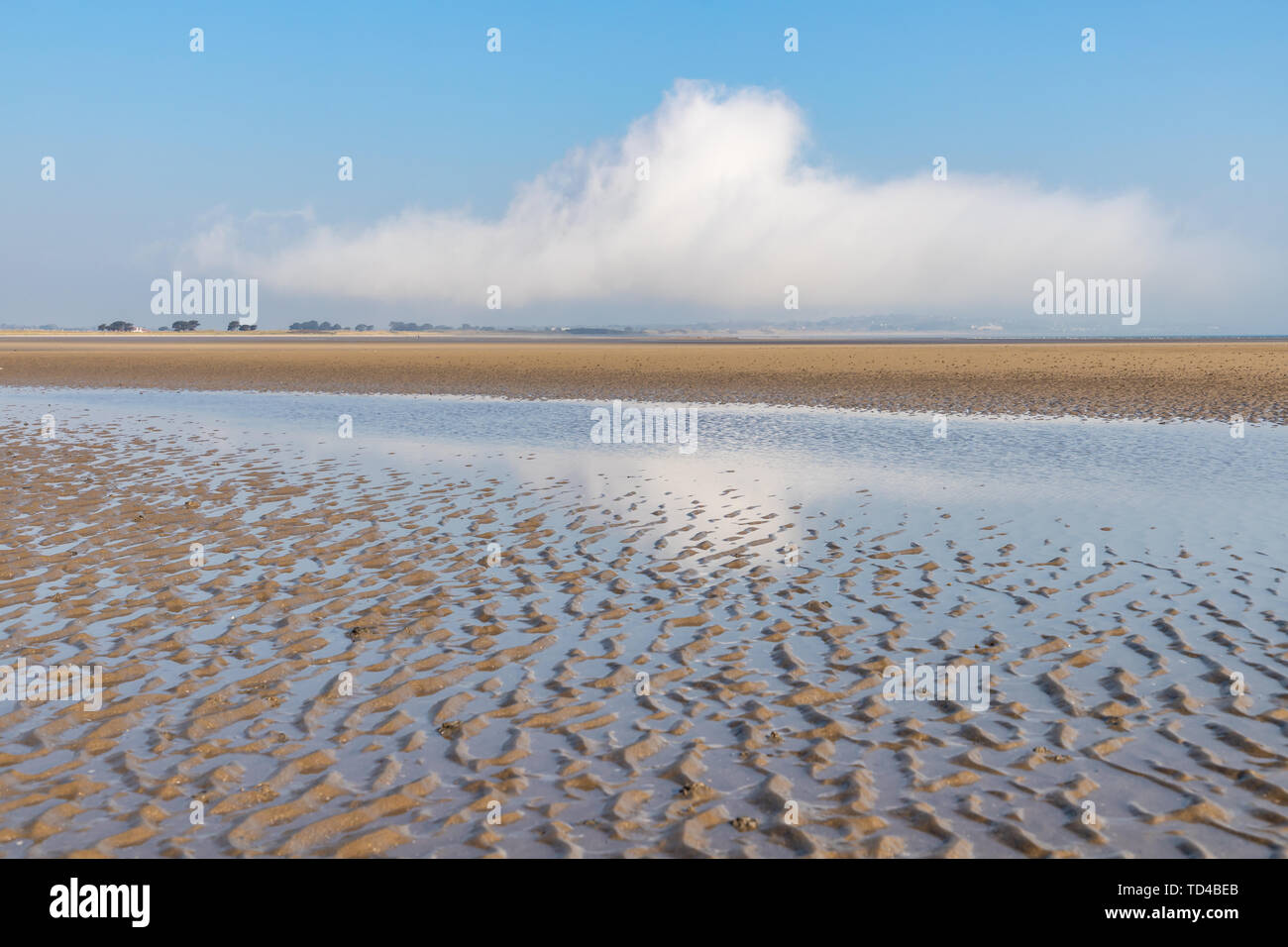 Clouds and sand with reflection in Burrow beach, Sutton, Dublin ...