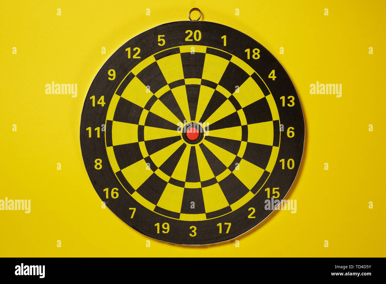 The empty target for a darts - dartboard isolated on yellow background ...