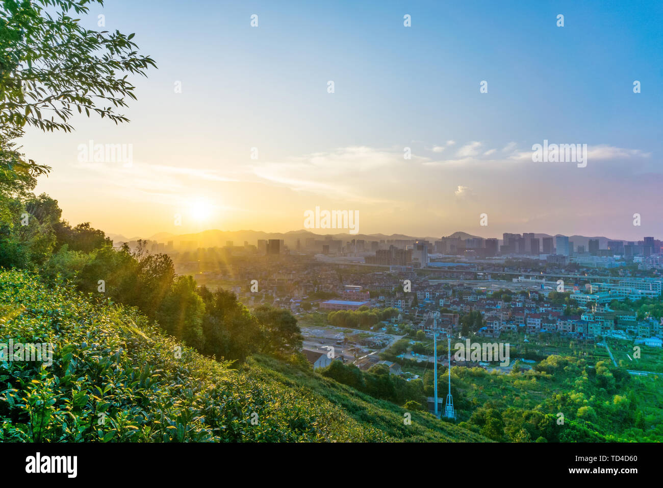 skyline and cityscape of city at foot of hill at sunrise time Stock ...