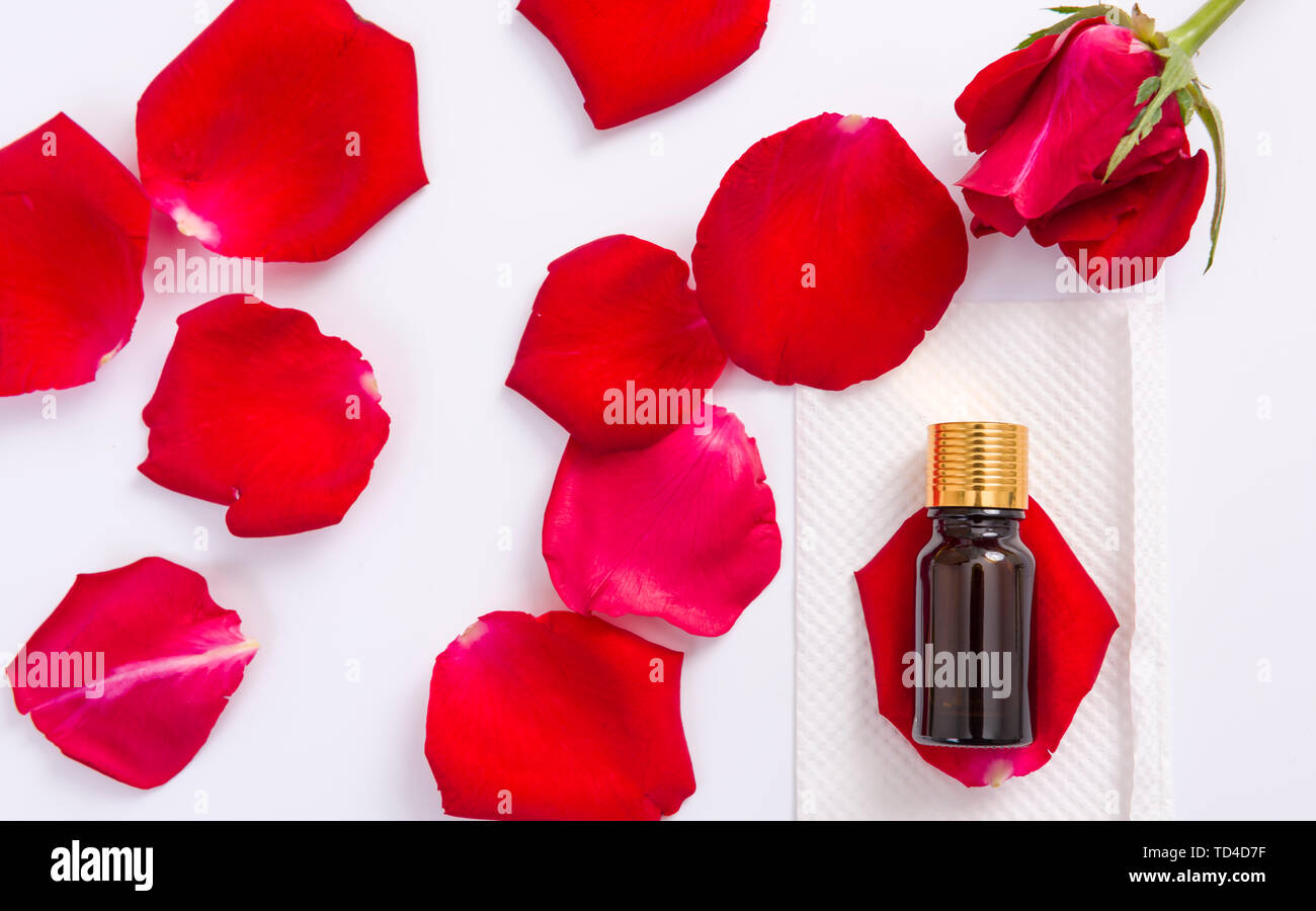 Red roses and essential oils Stock Photo - Alamy