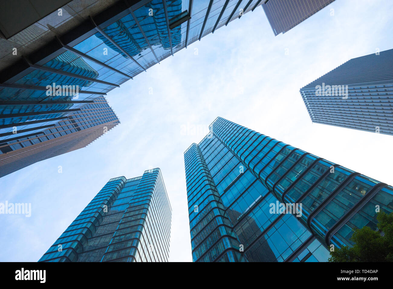 up view of modern office building in cloud sky Stock Photo - Alamy