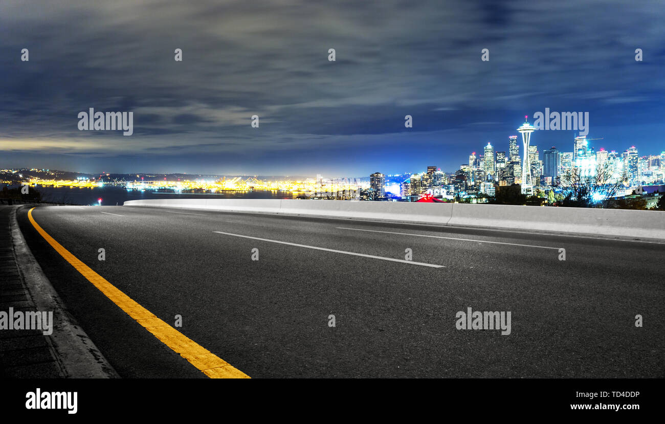 asphalt road with cityscape of seattle at night Stock Photo - Alamy