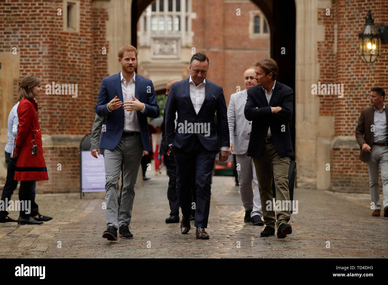 The Duke of Sussex walks with the Managing Director of Audi UK Andrew ...