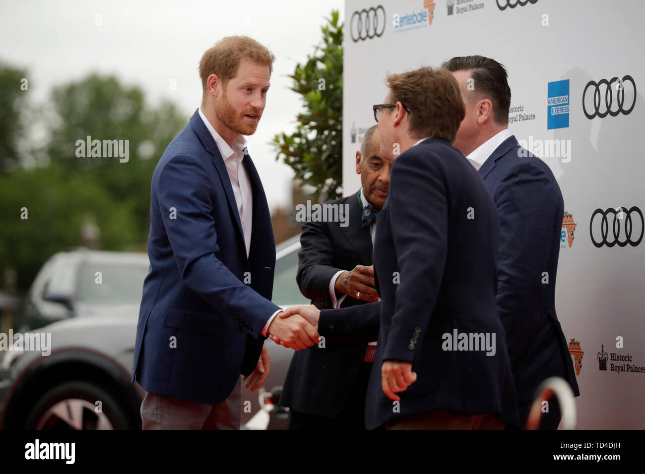 The Duke of Sussex is greeted by the Managing Director of Audi UK ...