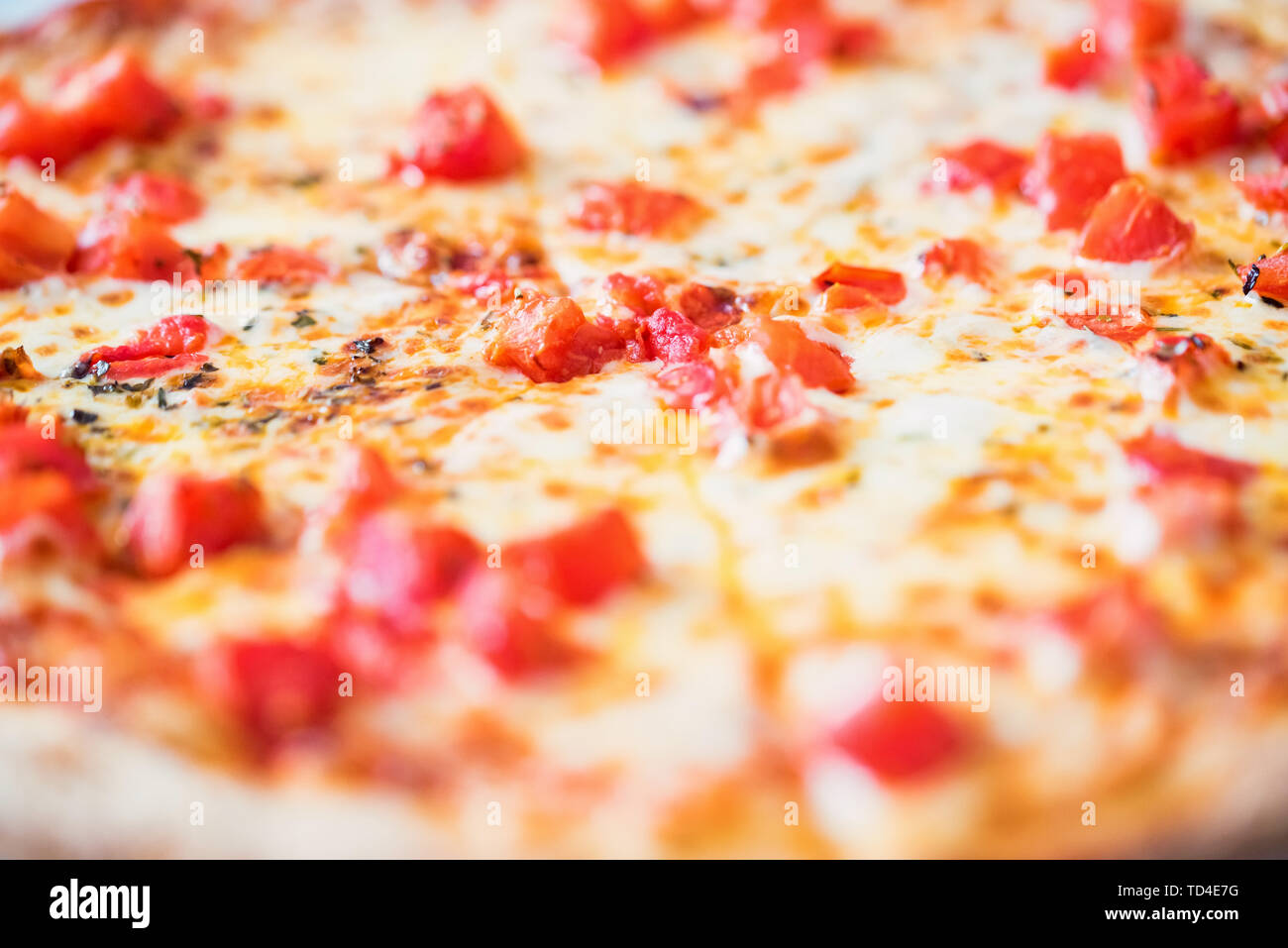 Delicious fresh pizza Margherita with tomatoes and cheese close up ...