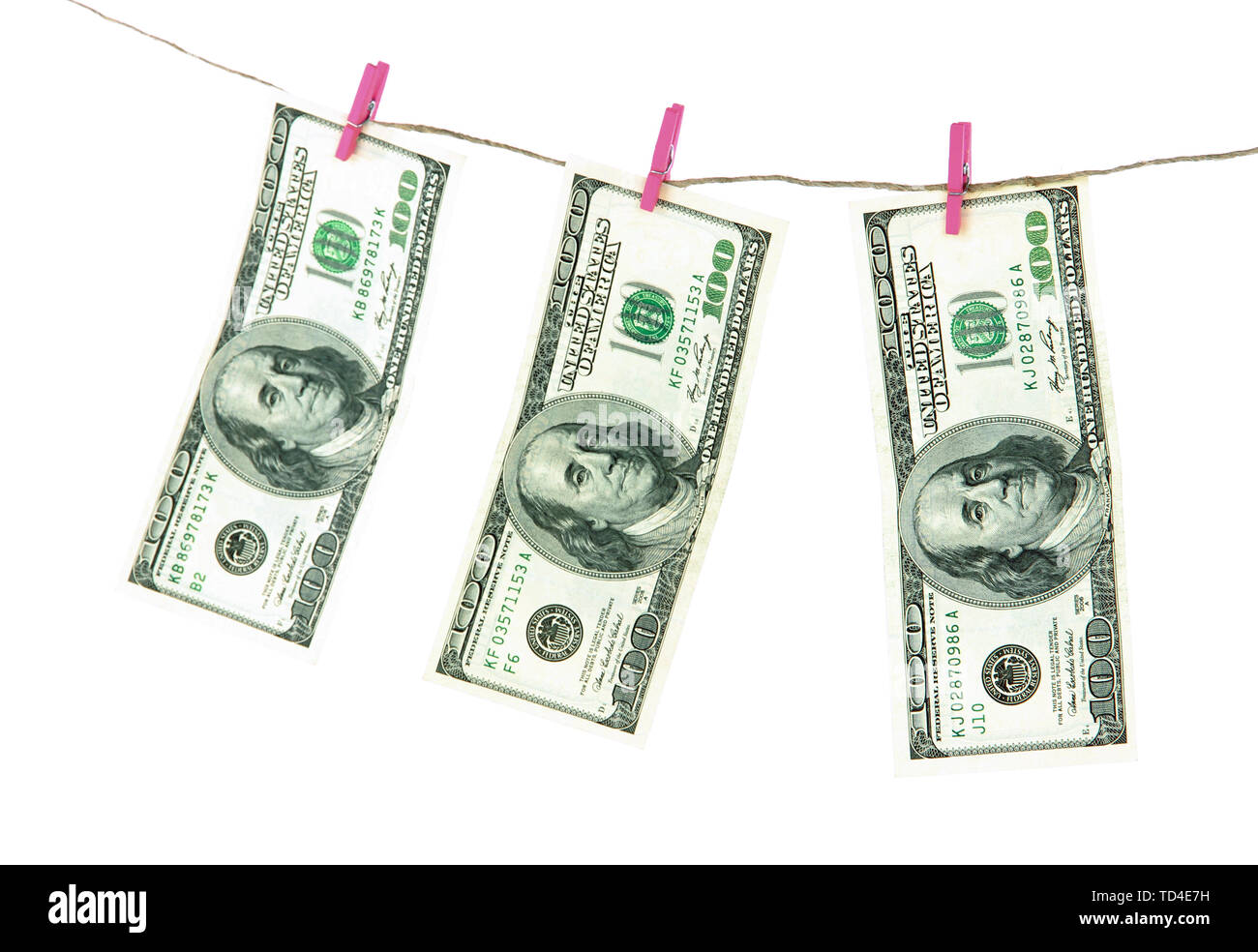Paper money on rope isolated on white Stock Photo - Alamy