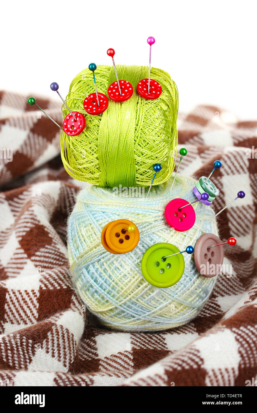 Buttons of different colors, and the two tangle thread Stock Photo - Alamy