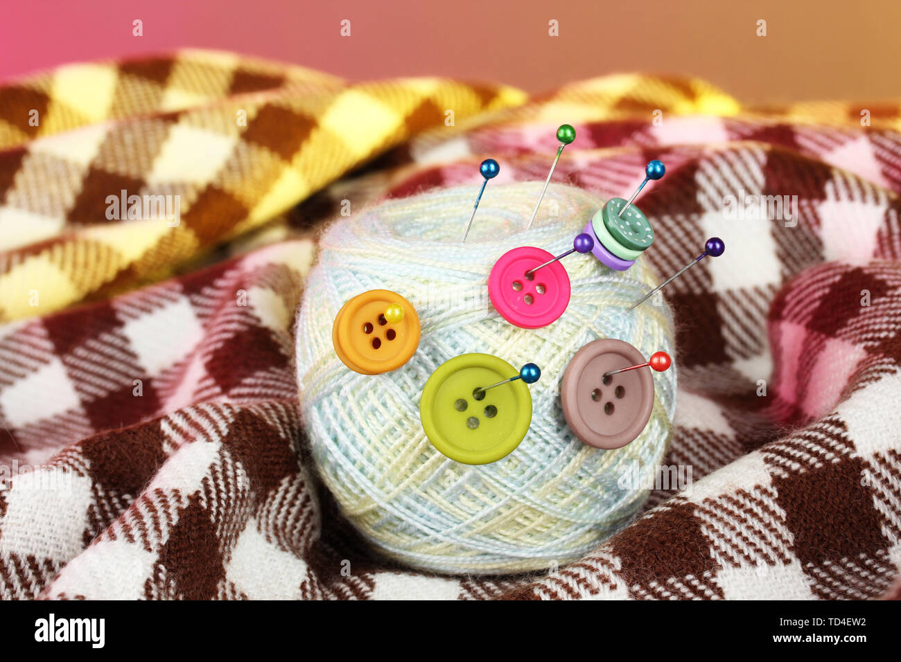 Ball of thread in the buttons Stock Photo - Alamy