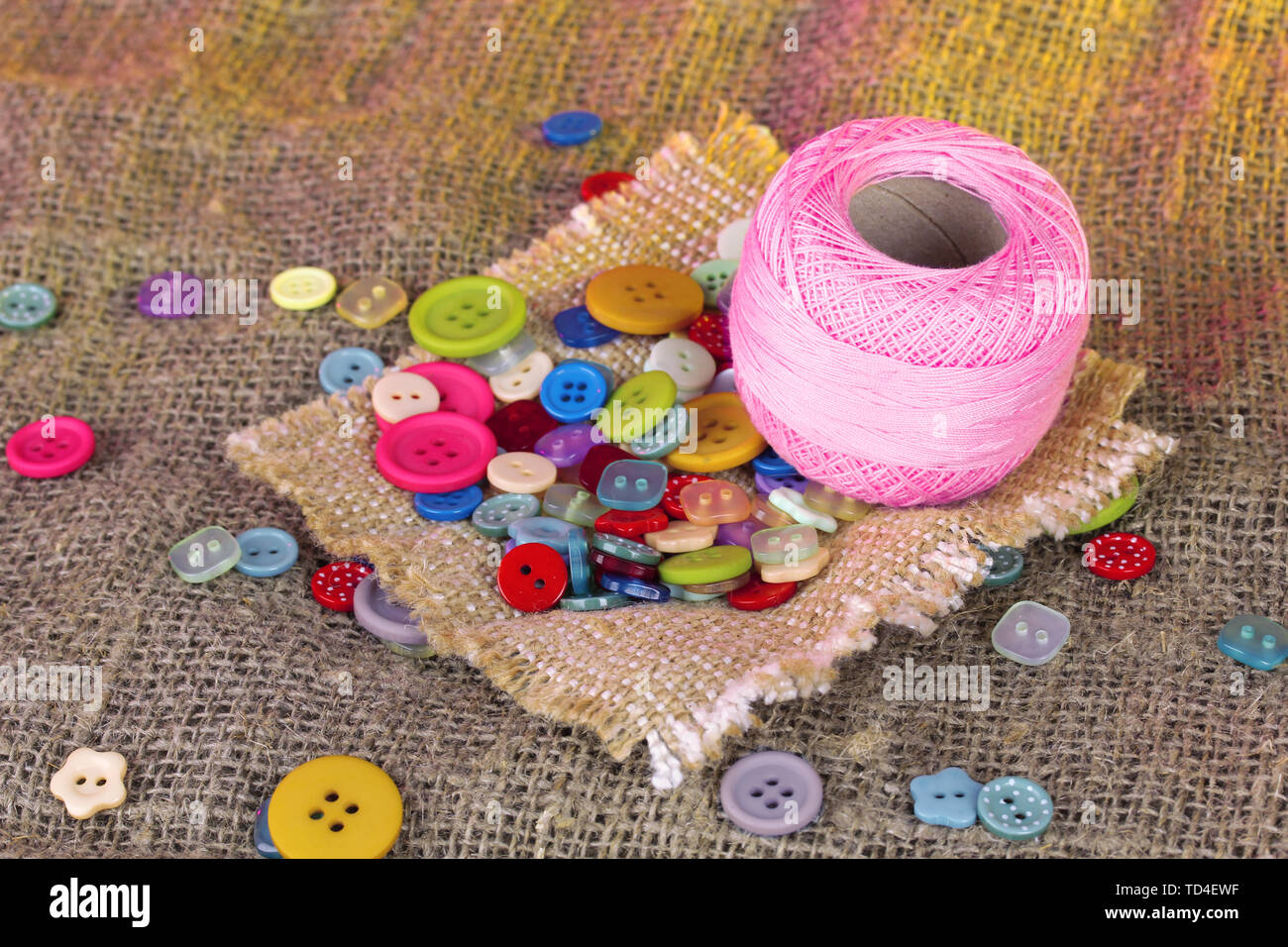 Beautiful buttons and a ball of yarn on a bright background Stock Photo ...
