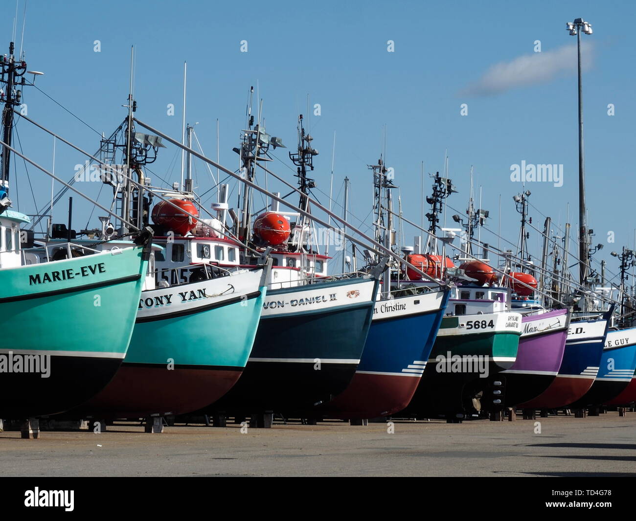 SHIPPAGAN, NEW BRUNSWICK, CANADA - August 24, 2017: Commercial fishing boats lined up in dry ...