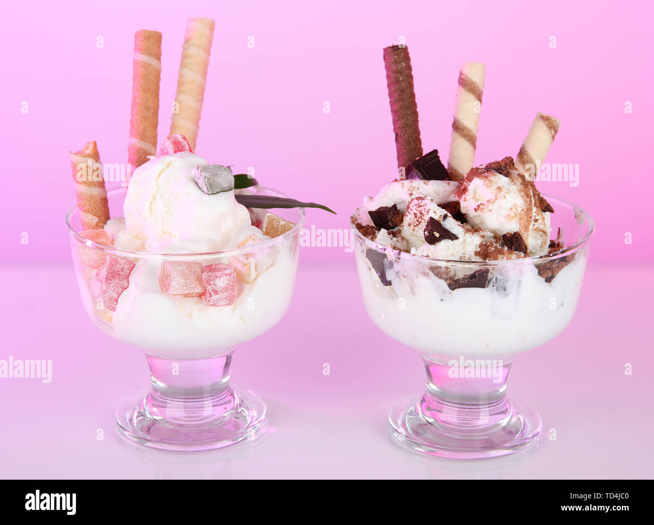 Ice cream with wafer sticks on pink background Stock Photo - Alamy