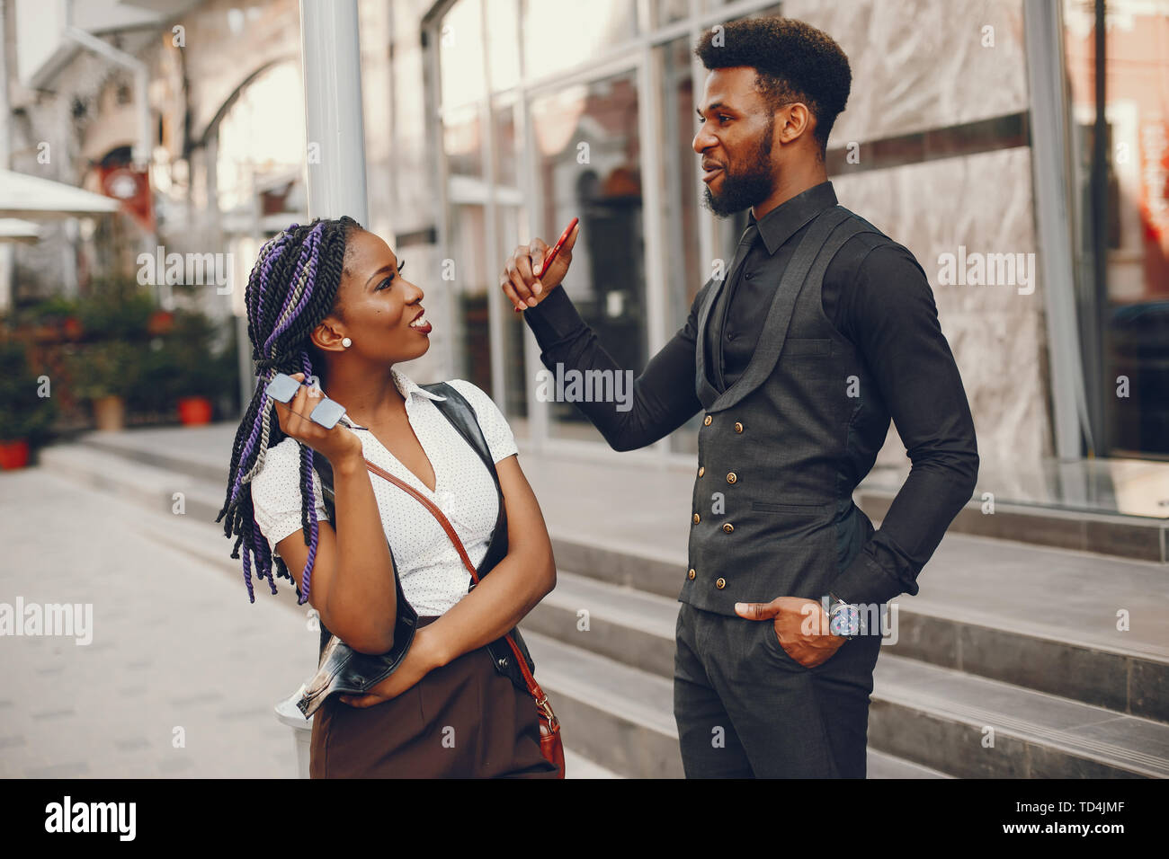 A stylish and beautiful dark-skinned couple in a city Stock Photo - Alamy