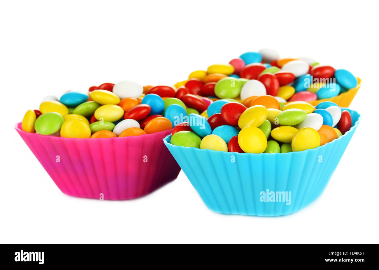Colorful candies in cupcake cases isolated on white Stock Photo - Alamy