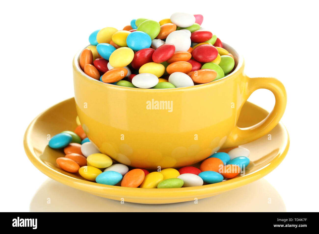 Colorful candies in cup isolated on white Stock Photo - Alamy