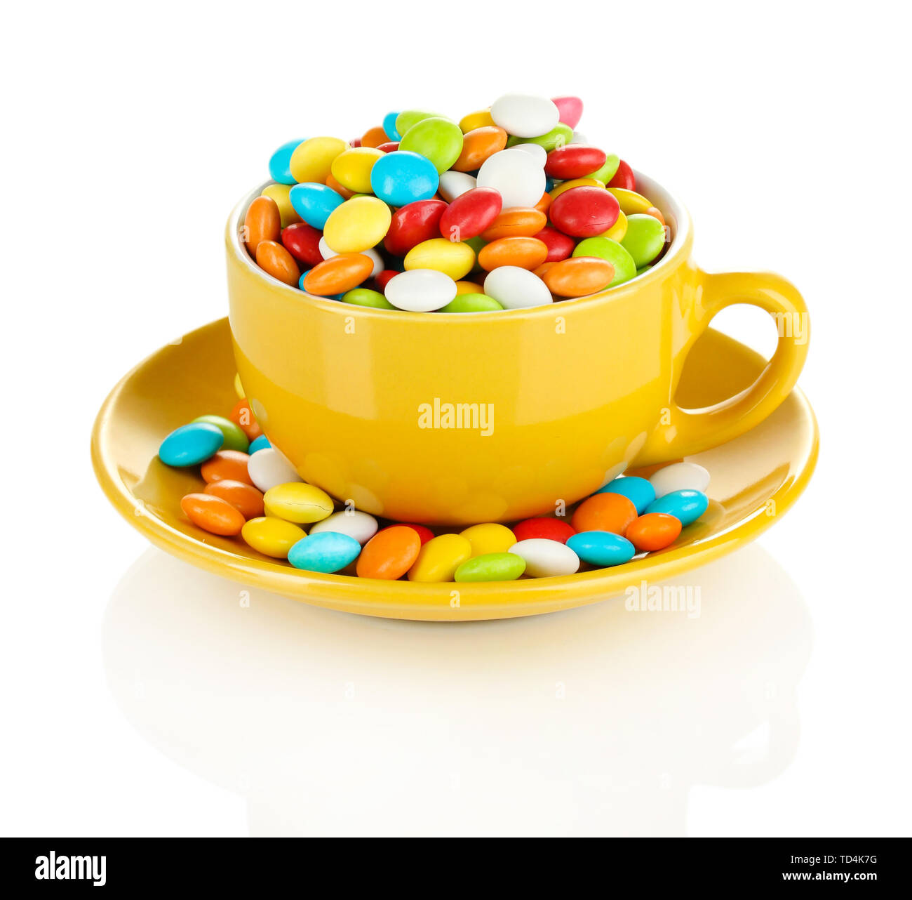 Colorful candies in cup isolated on white Stock Photo - Alamy