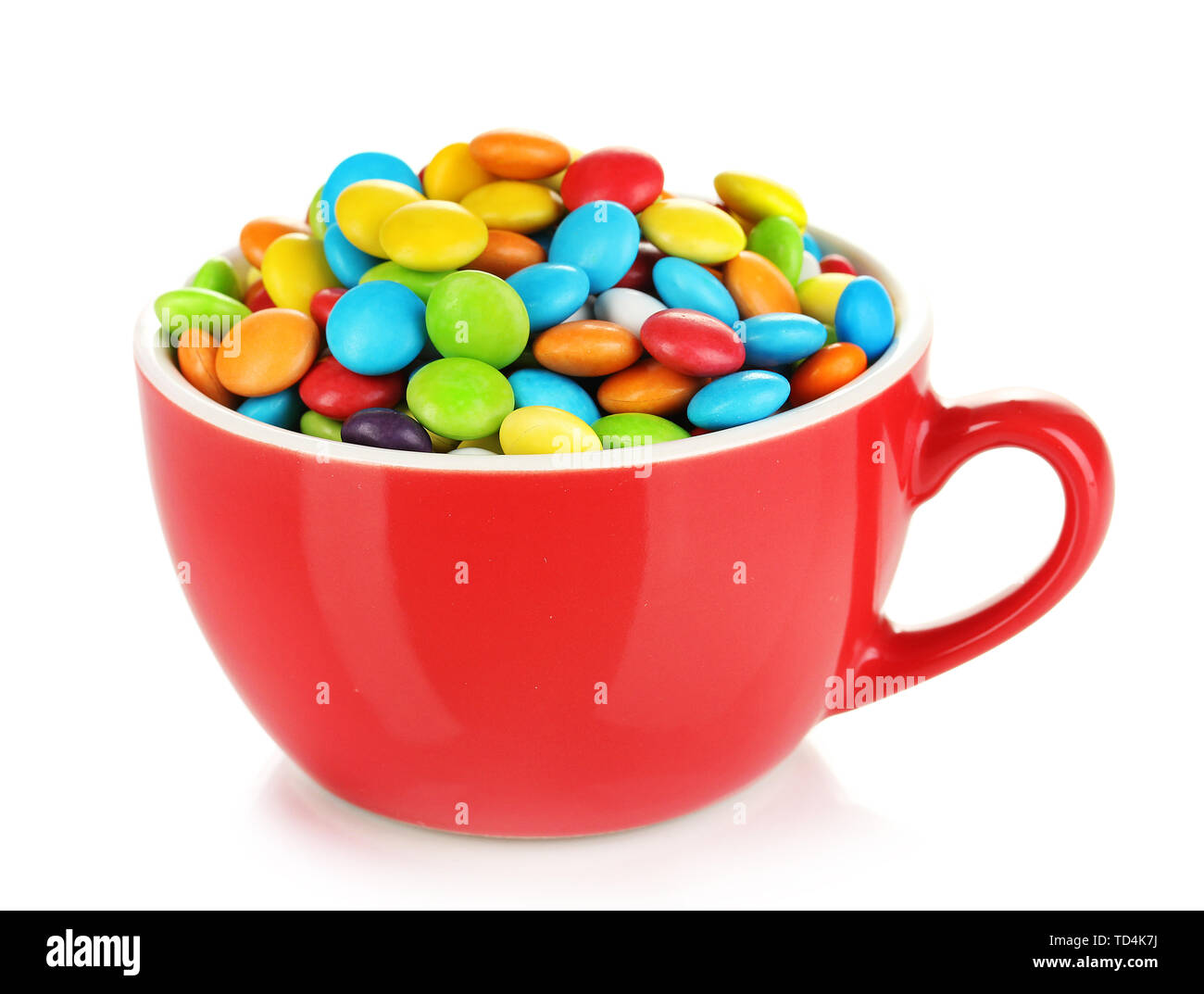 Colorful candies in cup isolated on white Stock Photo - Alamy