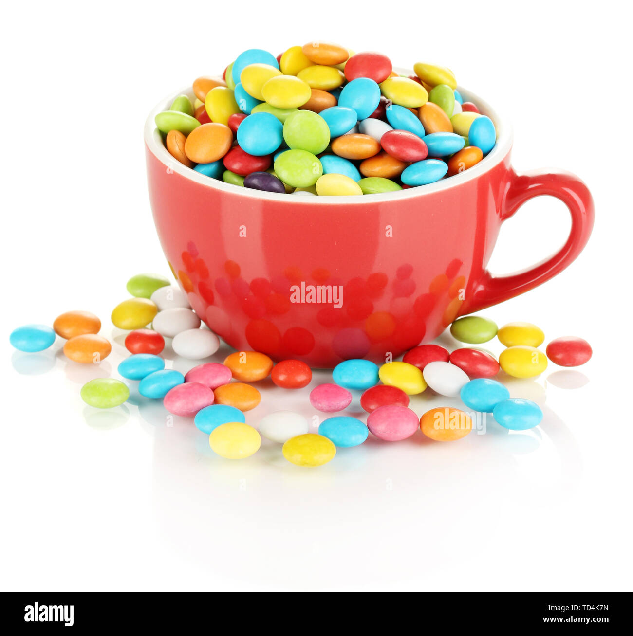 Colorful candies in cup isolated on white Stock Photo - Alamy