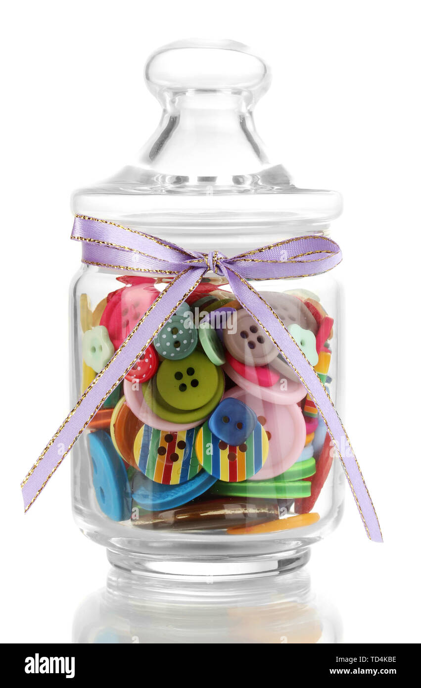 Glass jar containing various colored buttons isolated on white Stock ...