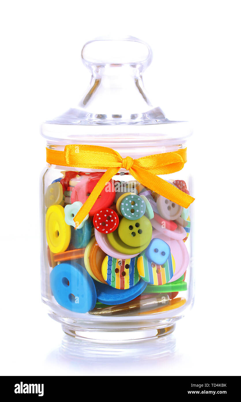 Glass jar containing various colored buttons isolated on white Stock ...