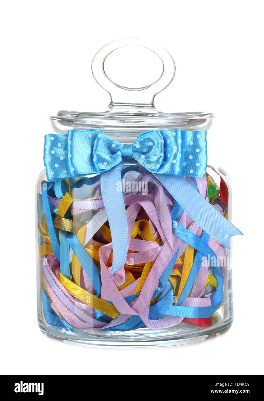 Glass jar containing various colored ribbons isolated on white Stock ...