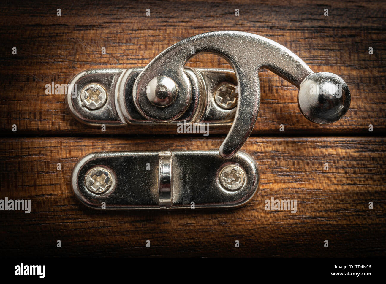 A close-up frontal view of a fancy silver-color sliding latch lock for ...