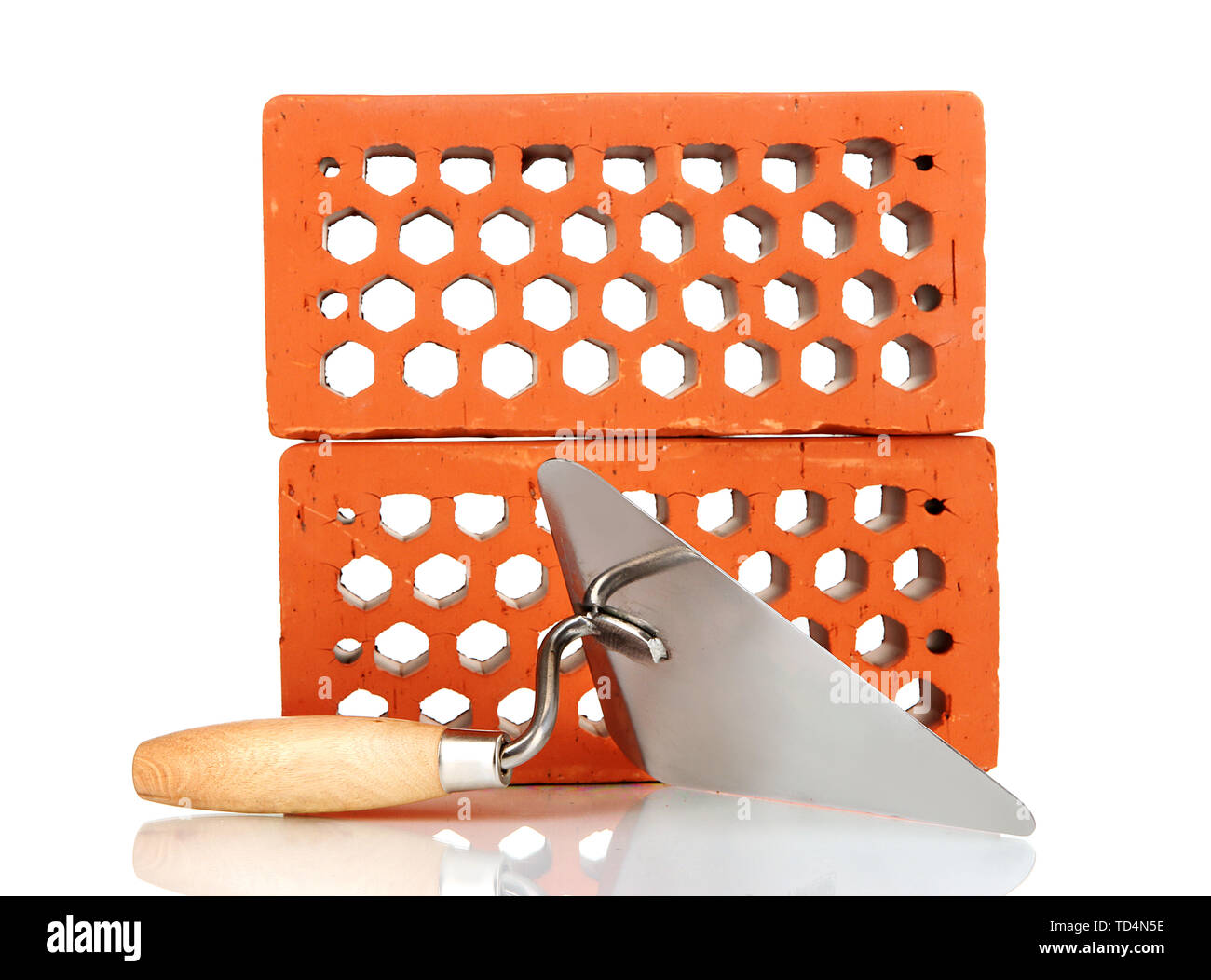 Metal tool for building and bricks isolated on white Stock Photo - Alamy