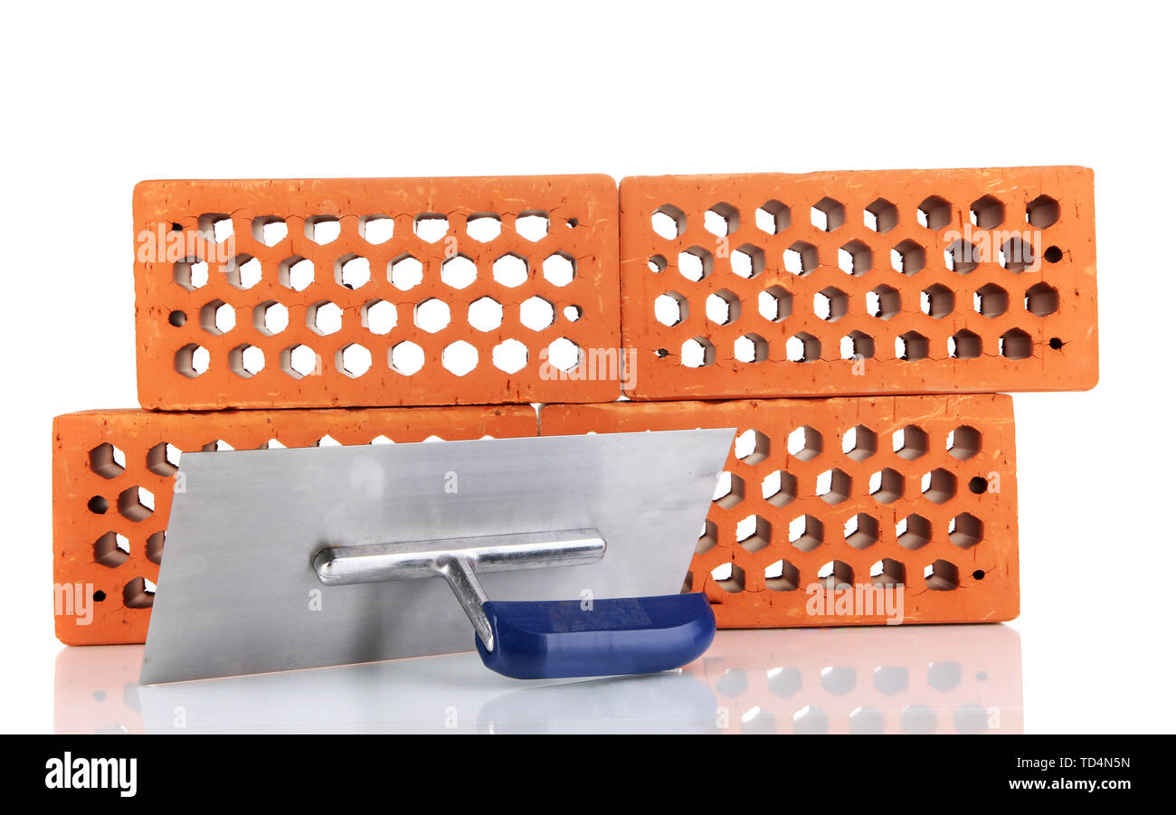 Metal tool for building and bricks isolated on white Stock Photo - Alamy