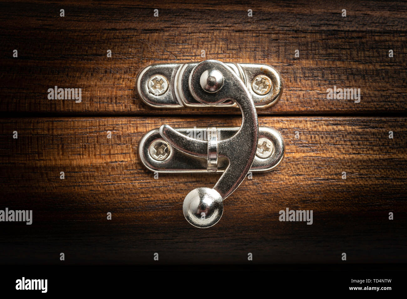 A close-up frontal view of a fancy silver-color sliding latch lock for ...