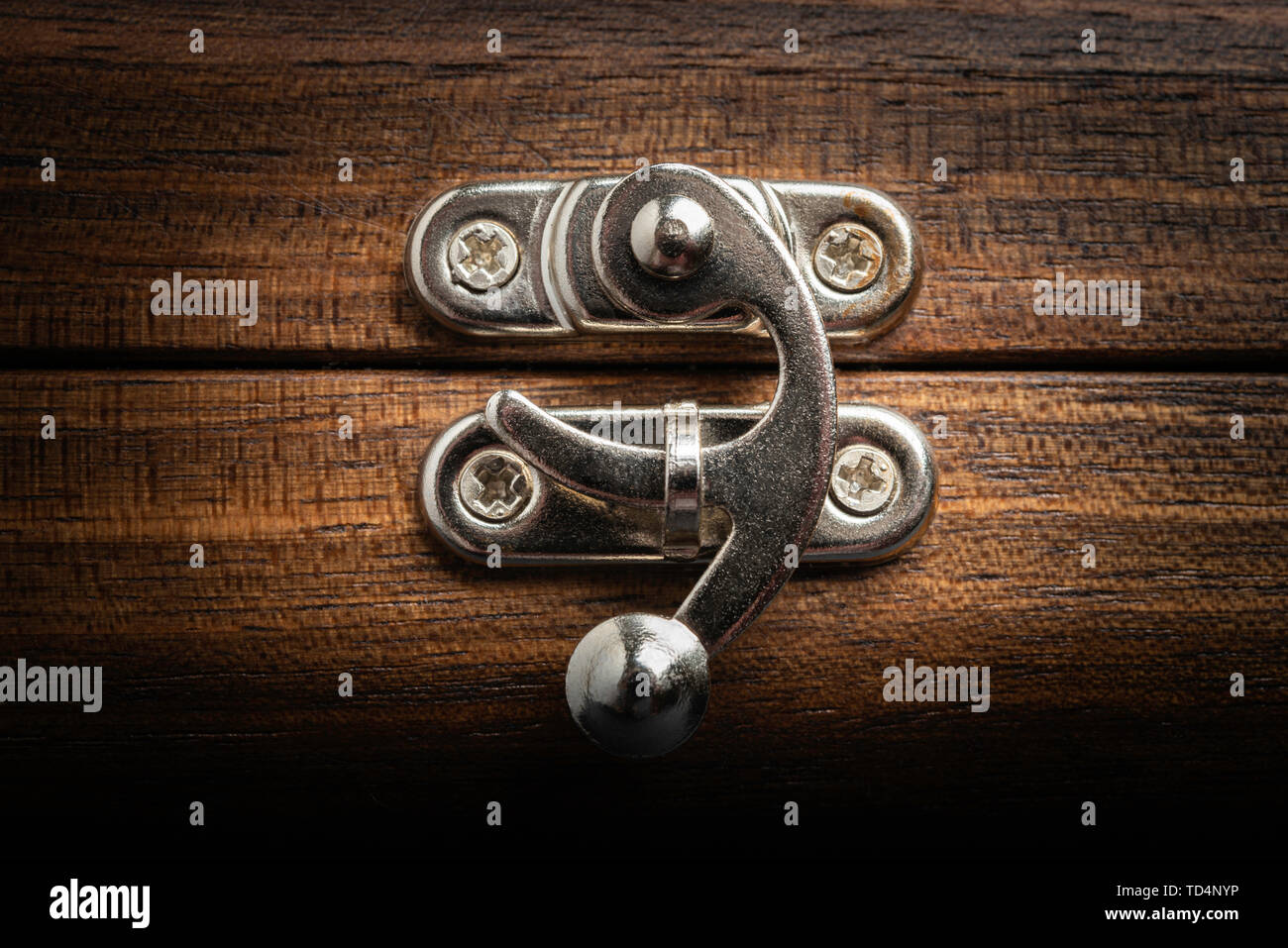 A close-up frontal view of a fancy silver-color sliding latch lock for ...