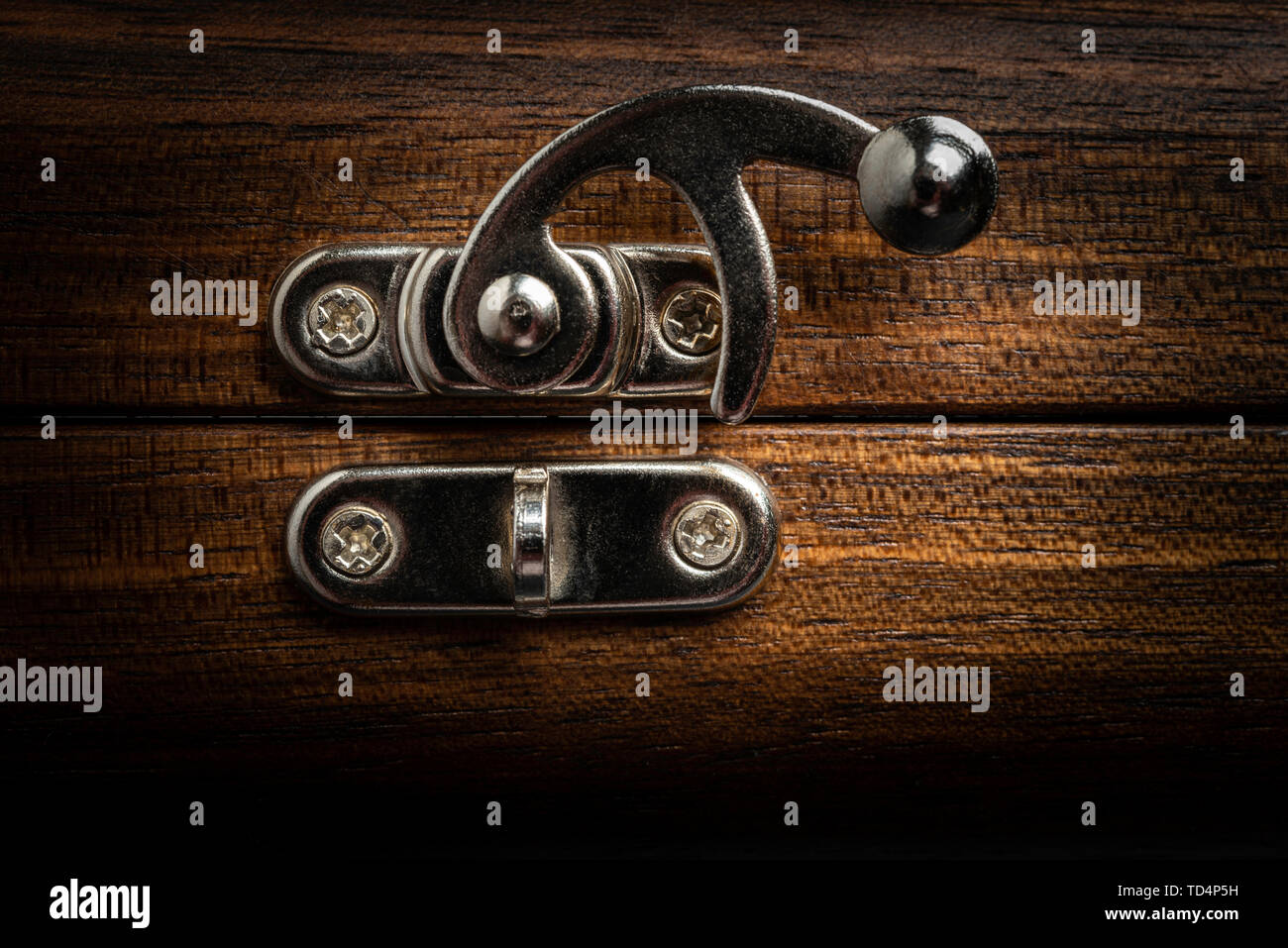 A close-up frontal view of a fancy silver-color sliding latch lock for ...