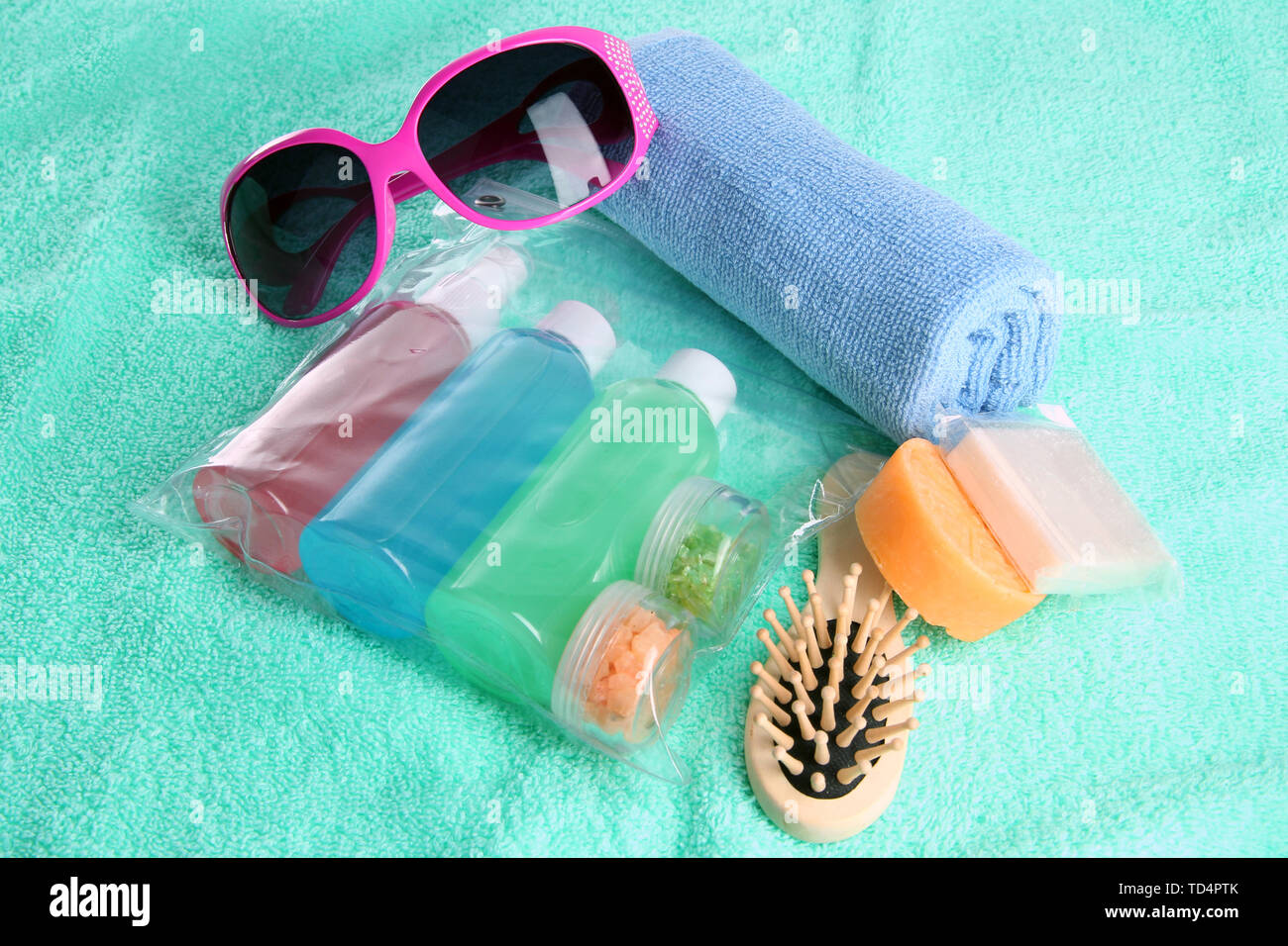 Hotel cosmetics kit on blue towel Stock Photo - Alamy