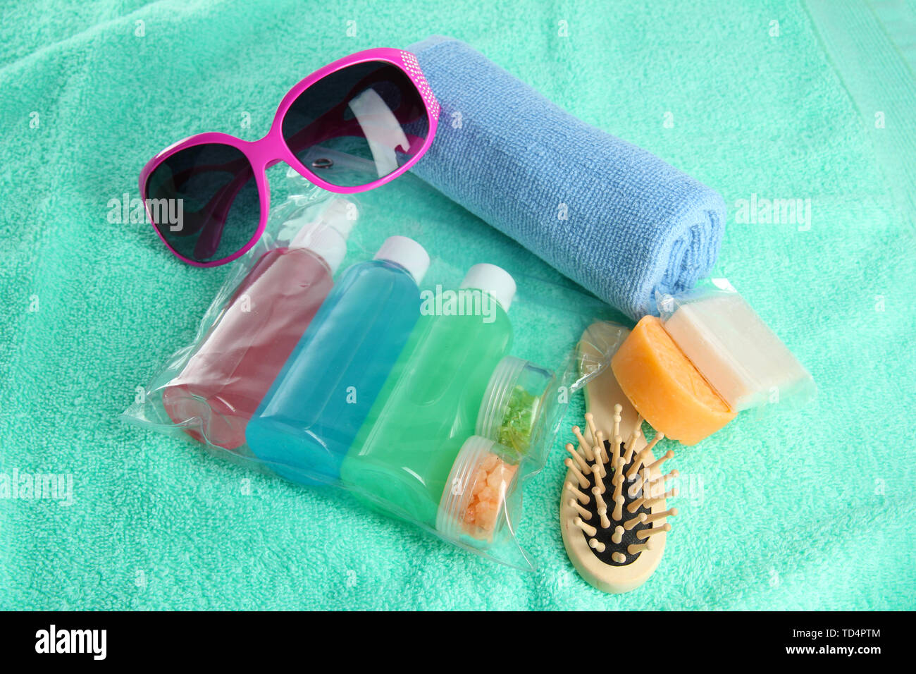 Hotel cosmetics kit on blue towel Stock Photo - Alamy