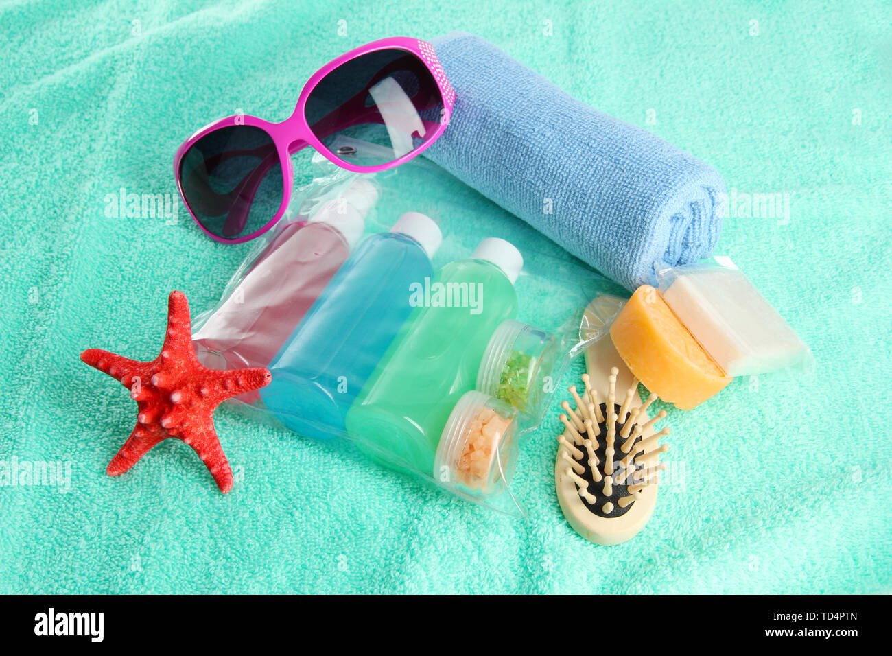 Hotel cosmetics kit on blue towel Stock Photo - Alamy