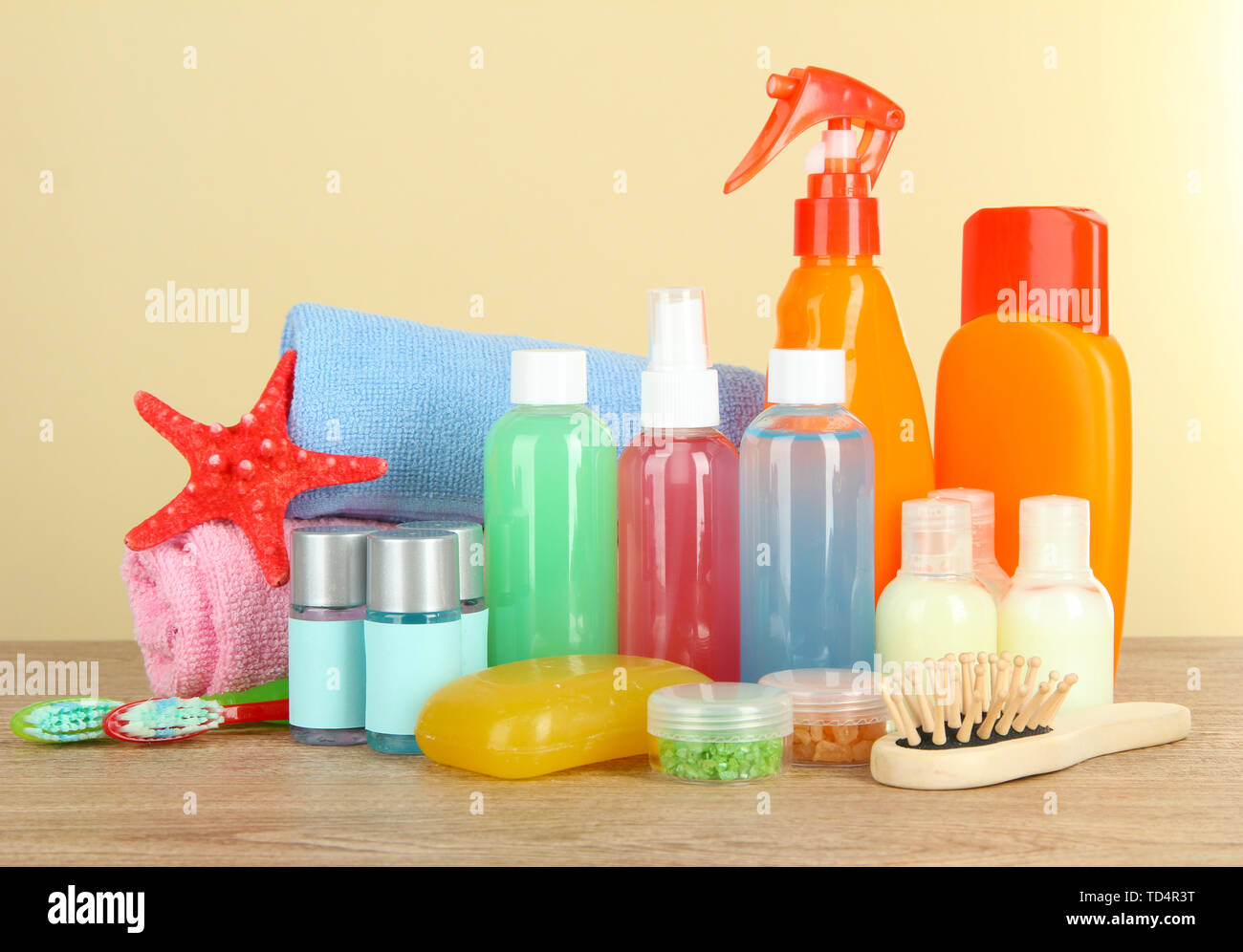 Hotel amenities kit on table on beige background Stock Photo - Alamy