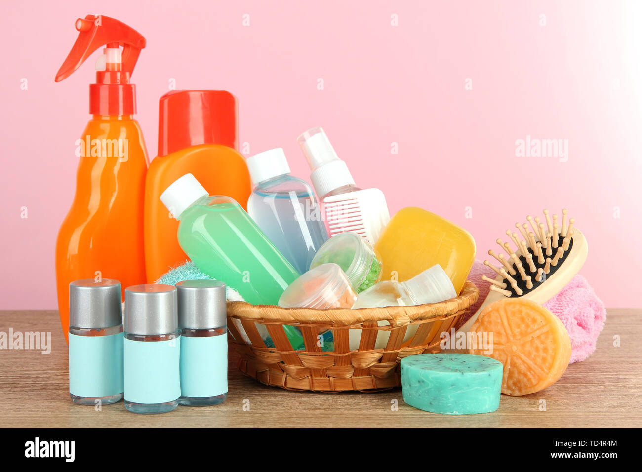 Hotel amenities kit on table on pink background Stock Photo - Alamy