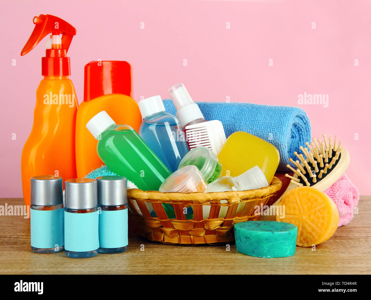 Hotel amenities kit on table on pink background Stock Photo - Alamy