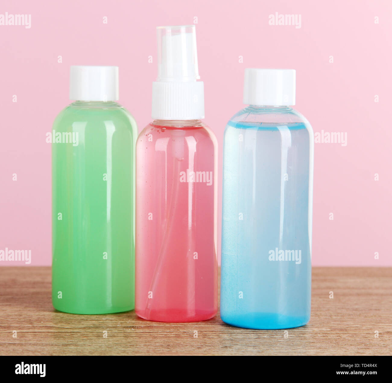 Hotel amenities kit on table on pink background Stock Photo - Alamy