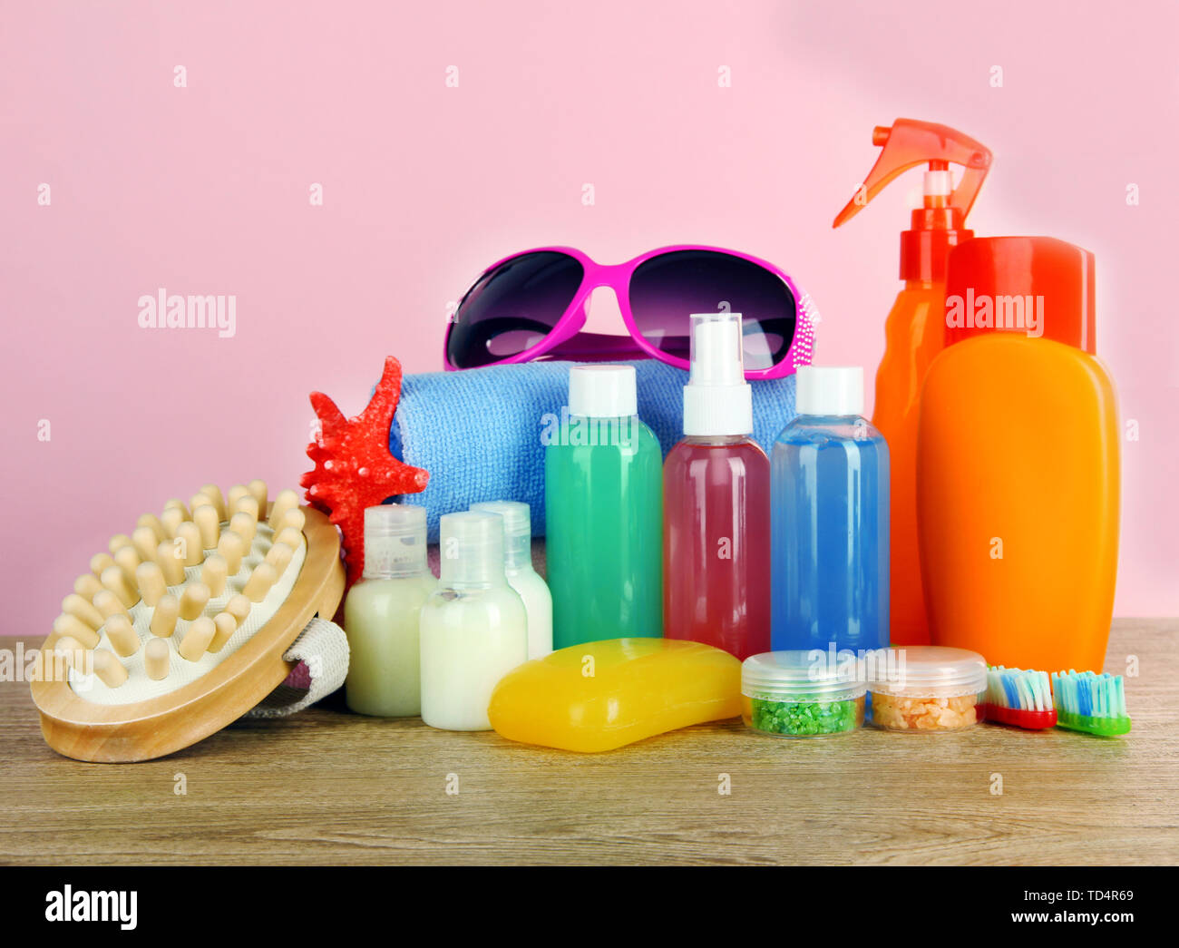 Hotel amenities kit on table on pink background Stock Photo - Alamy