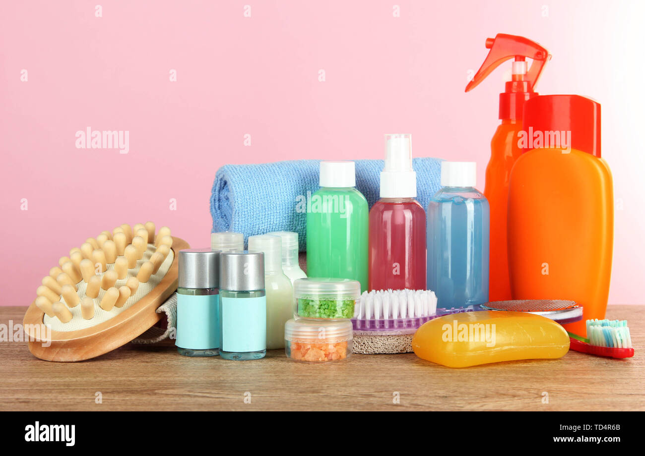 Hotel amenities kit on table on pink background Stock Photo - Alamy