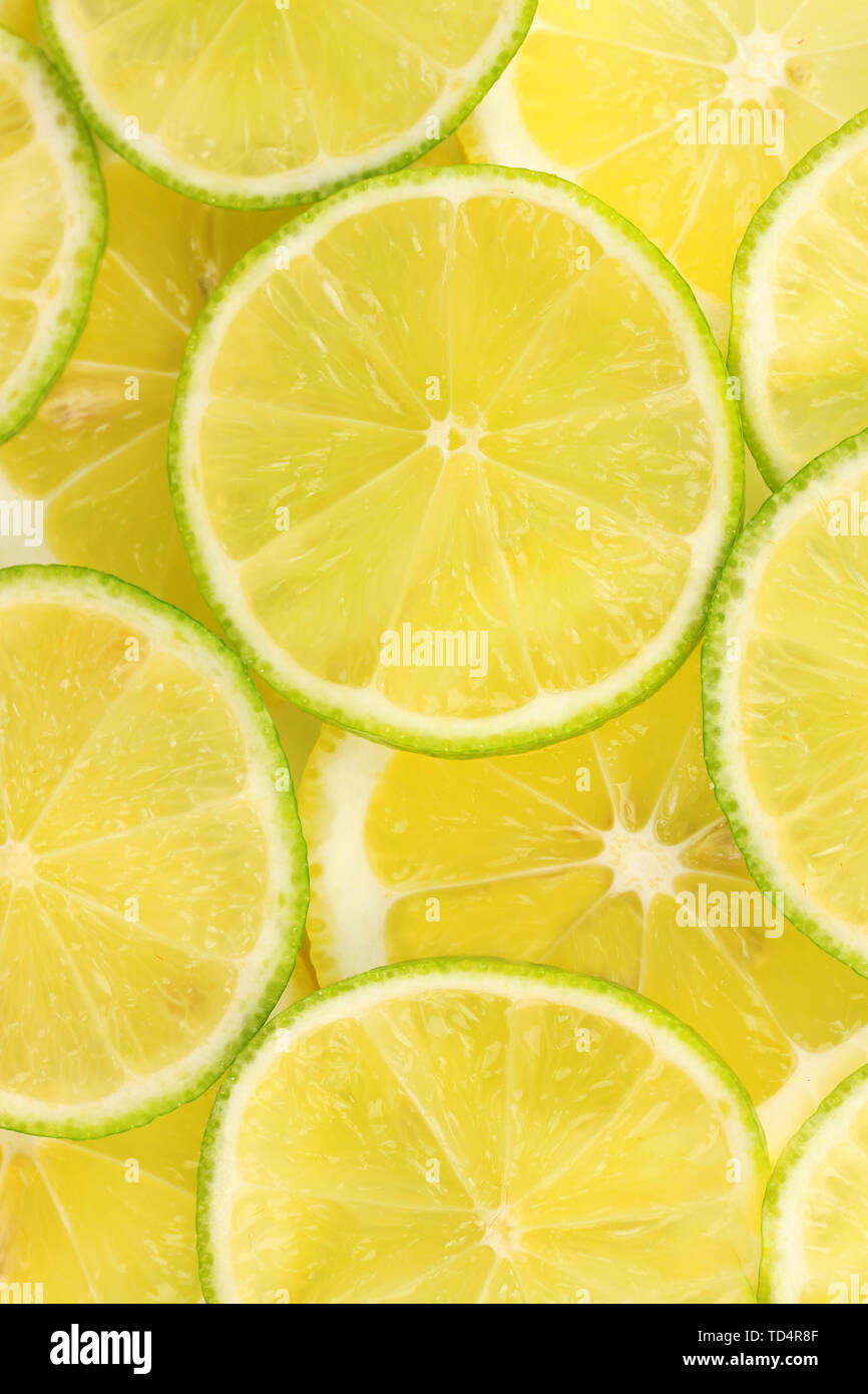 Lime and lemon slices background Stock Photo - Alamy