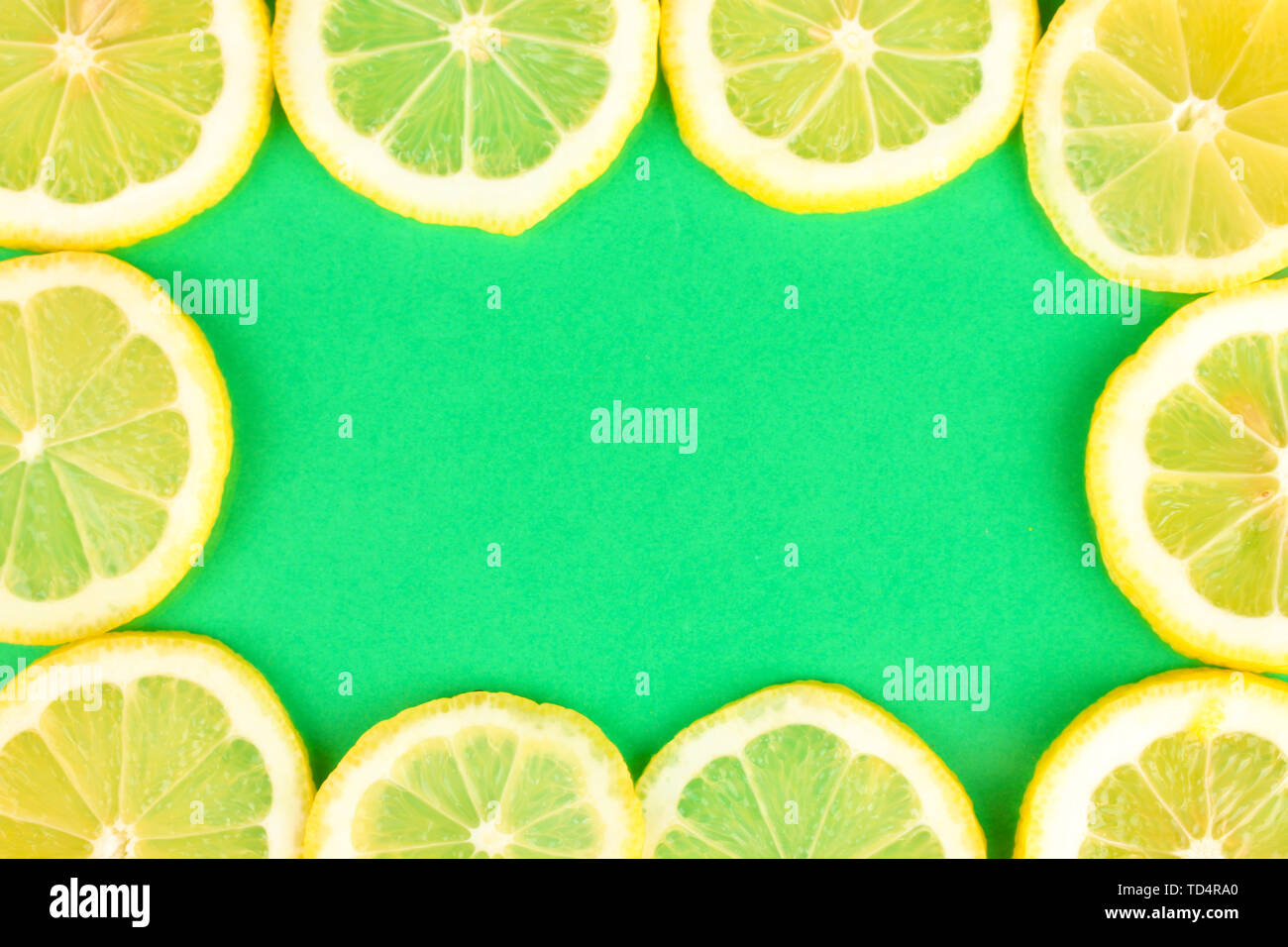 Lemon slices frame on color background Stock Photo - Alamy