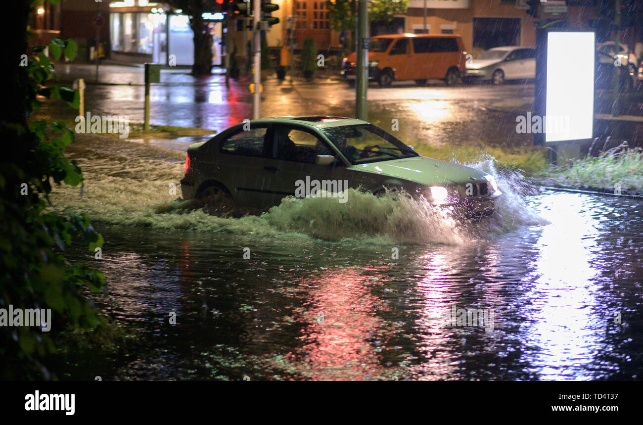 Berlin, Germany. 12th June, 2019. A car drives after a thunderstorm ...