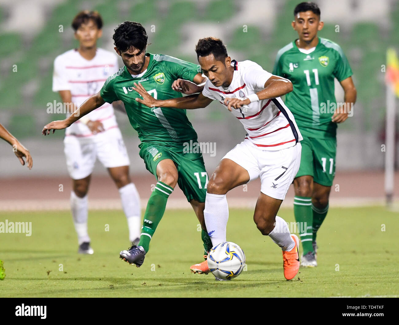 Doha, Qatar. 11th June, 2019. Ali Mahamood (L) of Pakistan vies with Prak Mony Udom (R) of ...