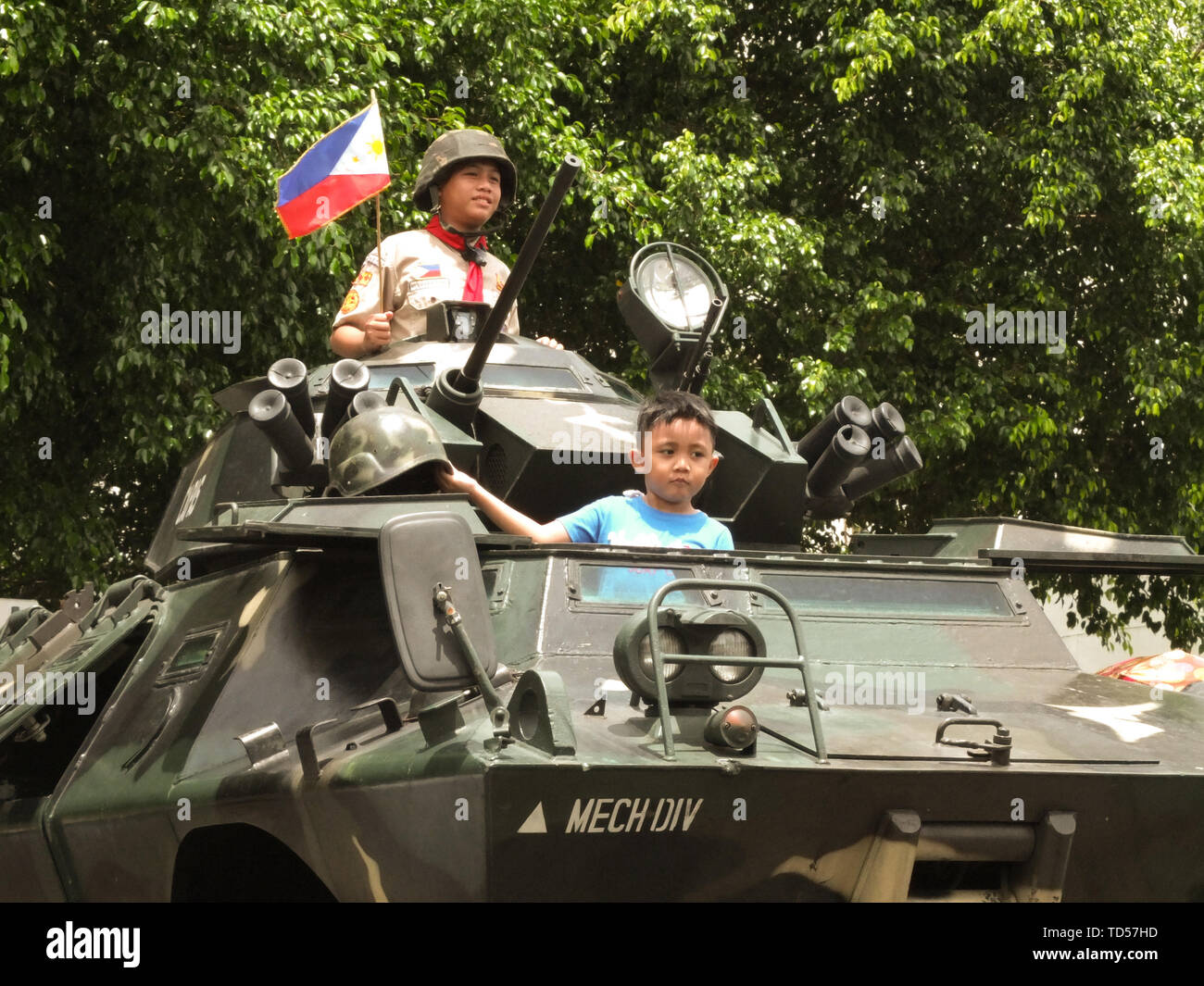 Manila, Philippines. 1st Jan, 2012. Youngsters ride on a Simba fighting ...